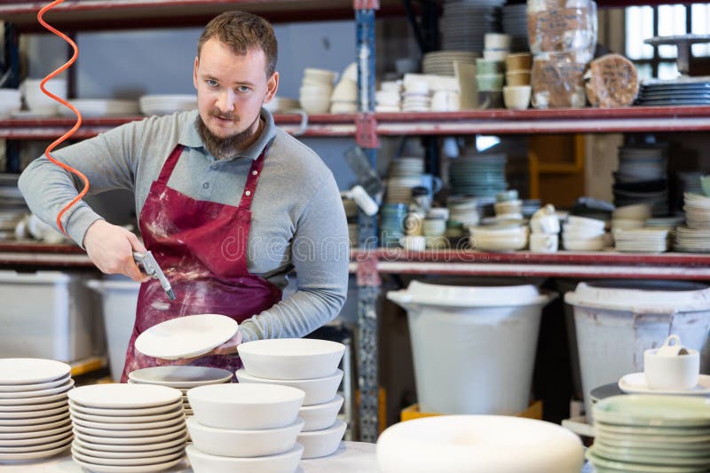 Young Man Paints Blanks of Ceramic Products Stock Photo - Image of ...
