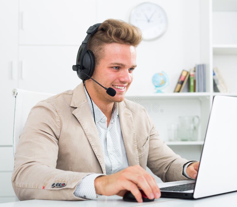 Young Man Working in Call Centre Stock Image - Image of helpdesk, male ...
