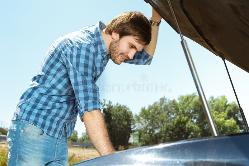 Young Man Working on a Car Engine Stock Photo - Image of male, trouble ...