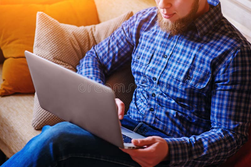 Young Man Working with Computer on the Beach. Handsome Man Working with ...