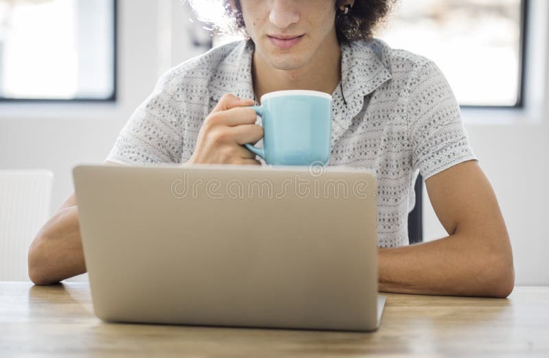 Young Man Working with Computer and Drinking Coffee Stock Image - Image ...