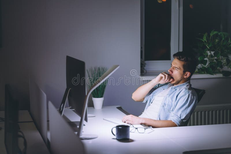 Young Man Working on Computer at Night in Dark Office Stock Photo ...