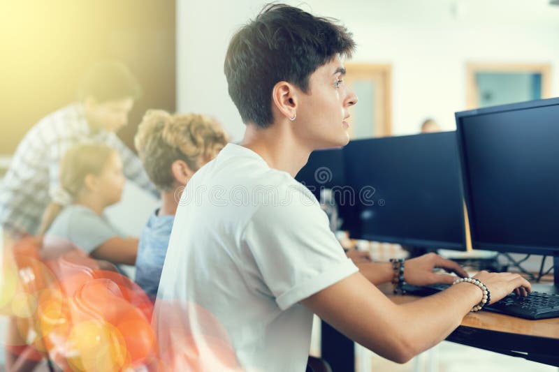 Young Man Working on Computer in it Training Room Stock Image - Image ...