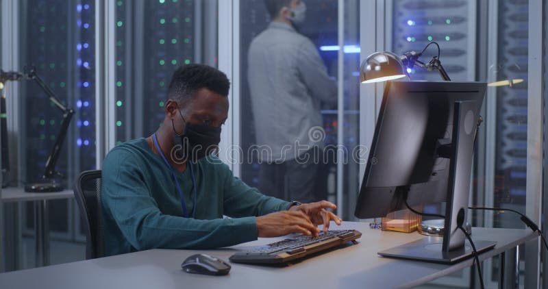 Young Man Working in Data Center Stock Photo - Image of computer ...