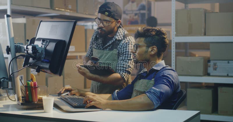 Young Man Working in Distribution Center Stock Image - Image of ...