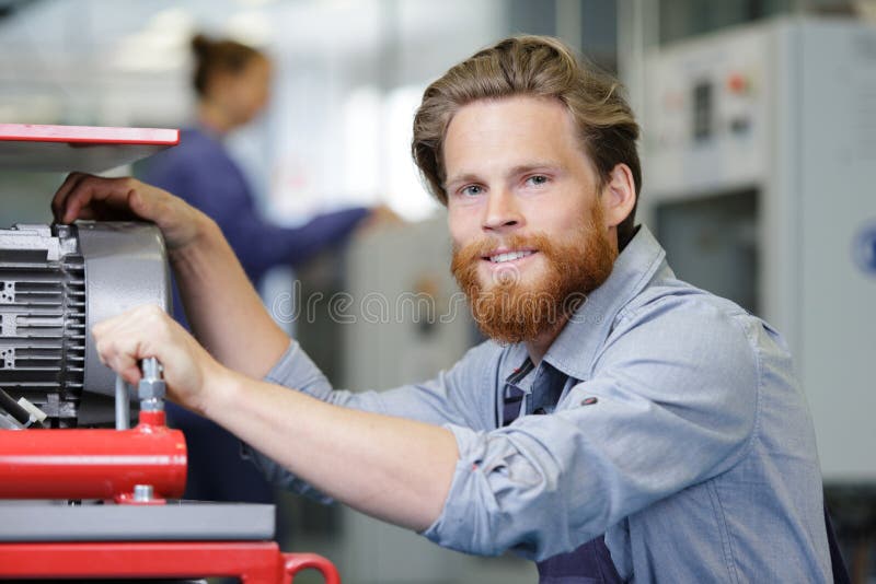 Young Man Working in Factory Stock Photo - Image of renewable ...