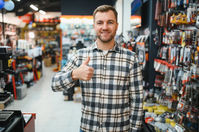 Young Man Working in Hardware Store Stock Image - Image of seller ...