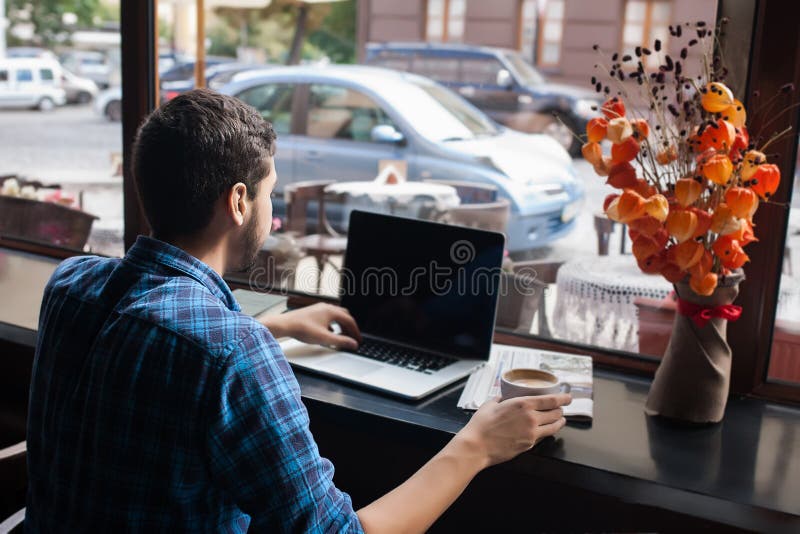 Young Man Working on His Computer at the Cafe Stock Image - Image of ...