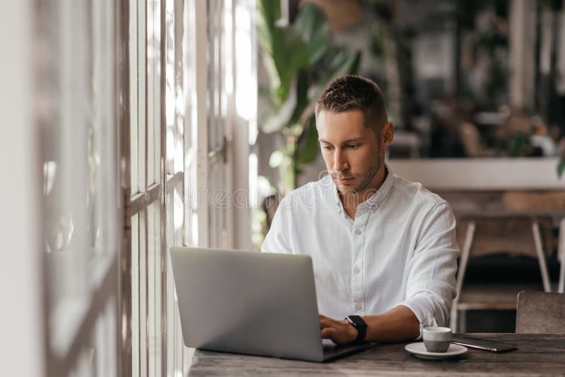 Young Man Working on His Computer at the Cafe Stock Image - Image of ...