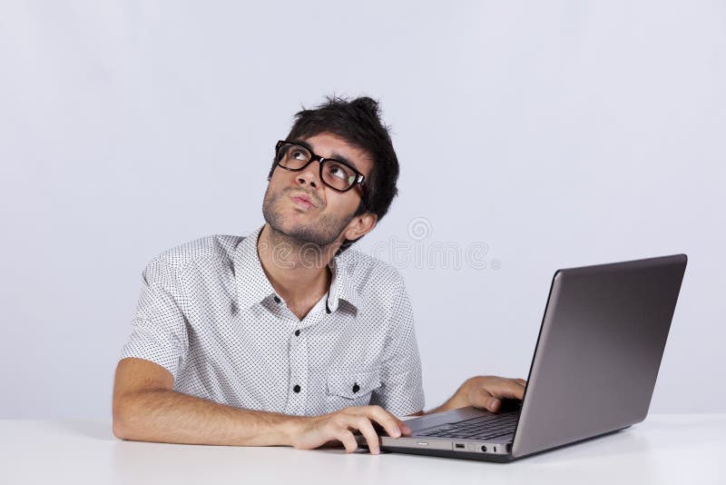 Weird Shocked and Surprised Geek Man in Nerd Glasses Working on Laptop ...