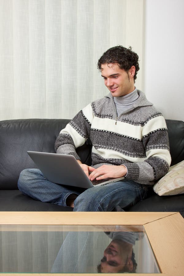 Young Man Working on His Laptop, at Home Stock Photo - Image of relax ...