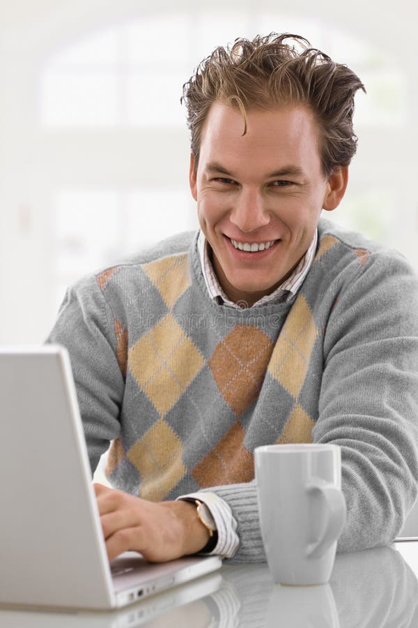 Young man working at home stock image. Image of happiness - 7823587