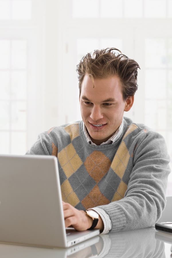 Man Working on His Laptop Computer at Home Stock Photo - Image of ...