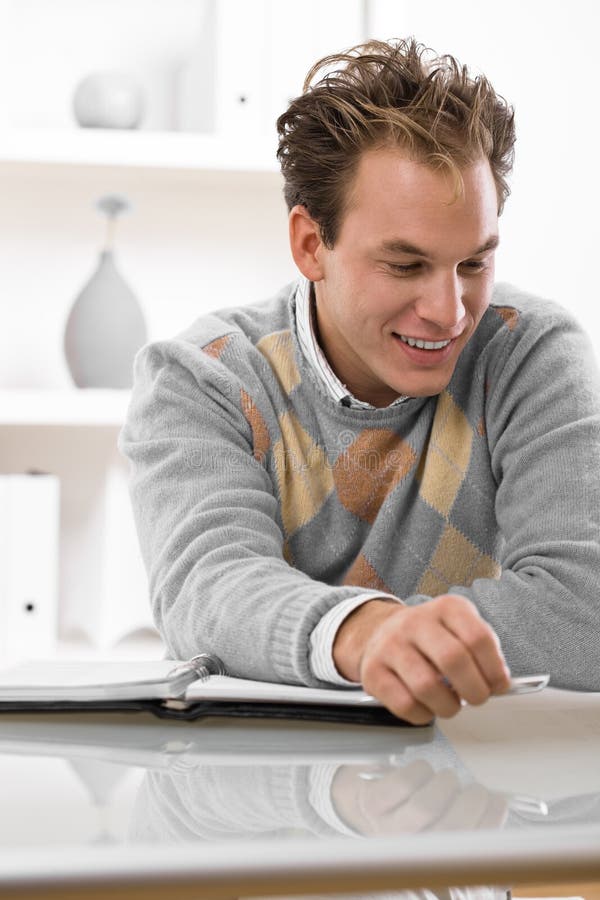 Young man working at home stock photo. Image of office - 8339598