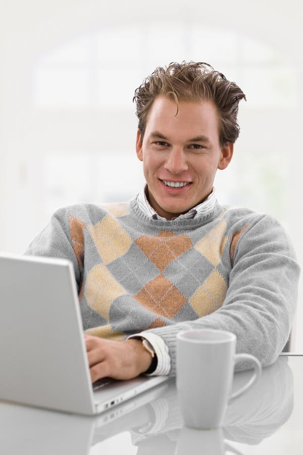 Young man working at home stock photo. Image of goodlooking - 8544194
