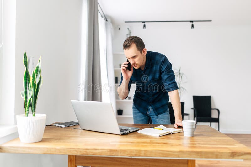 Young Man Working from Home Using Laptop. Stock Photo - Image of ...