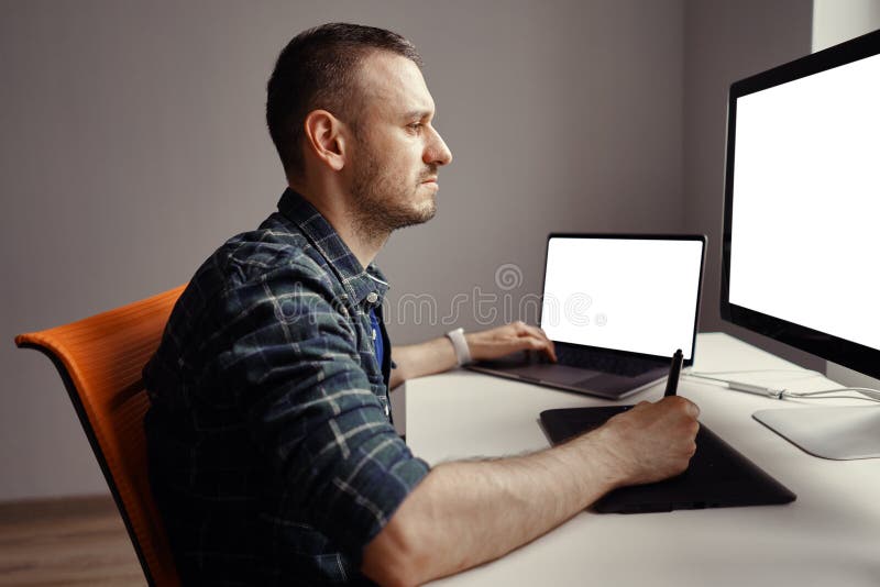 Young Man Working with Interactive Pen Display and Computer Stock Photo ...