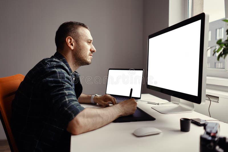 Young Man Working with Interactive Pen Display and Computer Stock Photo ...