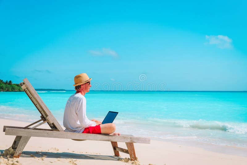 Young Man Working on Laptop at Beach Stock Photo - Image of enjoy ...