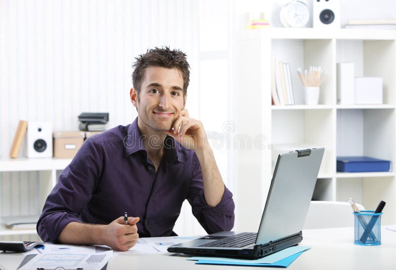 Young Man Working on Laptop Stock Photo - Image of working, computer ...
