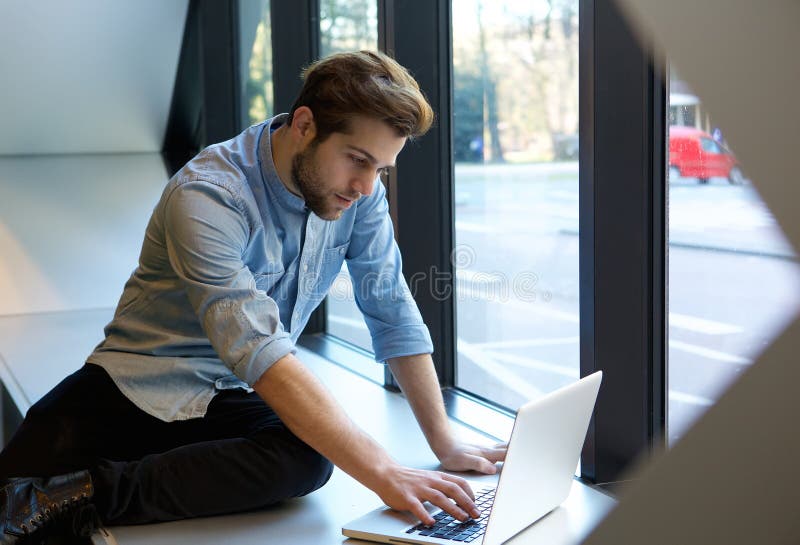Young Man Working on Laptop Stock Image - Image of adult, computer ...