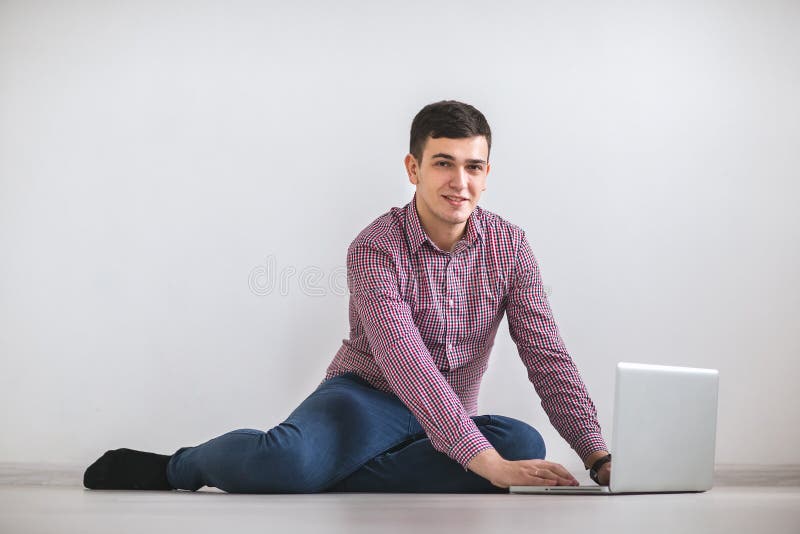 A Young Man Working on a Laptop Stock Photo - Image of store, house ...