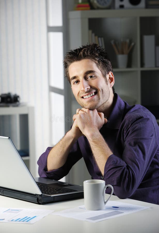Young Man Working on Laptop Stock Image - Image of laptop, toothy: 31341663