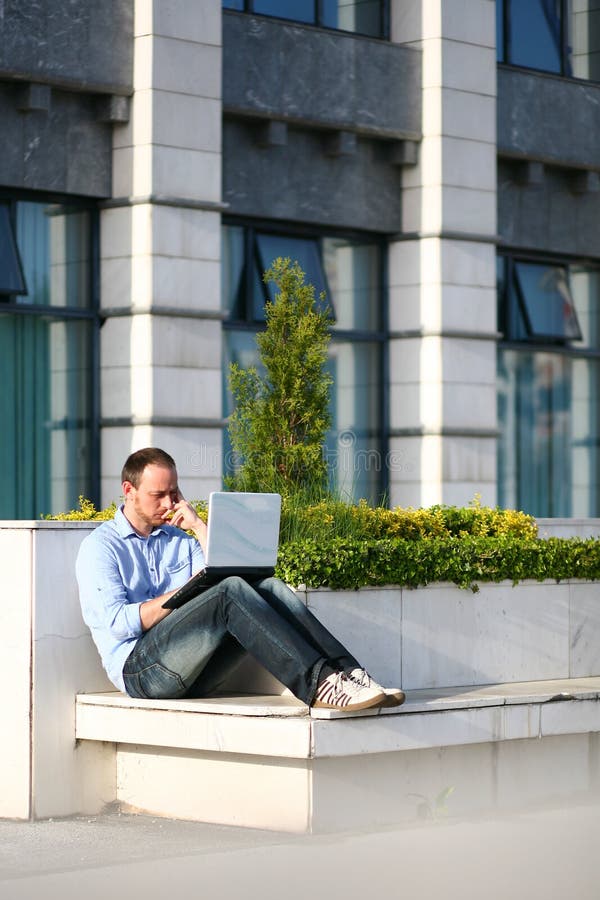 Young Man Working on Laptop Outside Stock Image - Image of outside ...