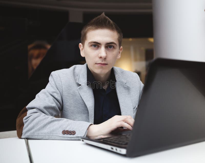 Young Man Working with Laptop Stock Image - Image of making, male: 30853201 Young Man Working with Laptop Stock Image - Image of making, male: 30853201