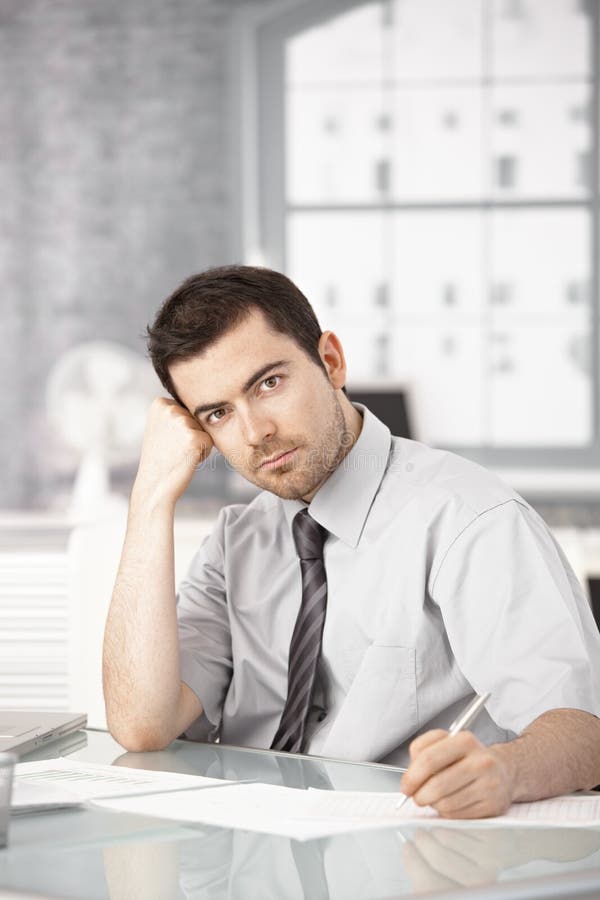 Young Man Working in Office Writing Notes Thinking Stock Photo - Image ...