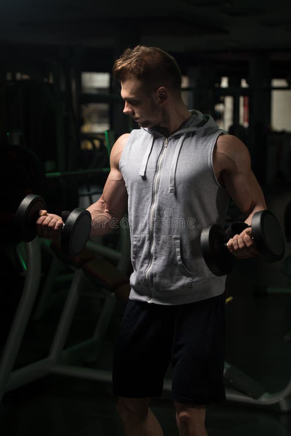 Young Man Working Out Biceps Stock Image - Image of lifestyles ...