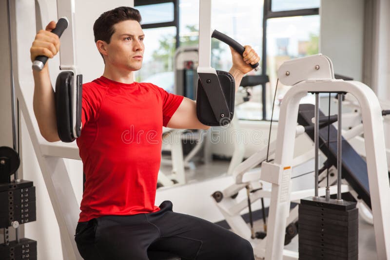 Young Man Working Out at the Gym Stock Photo - Image of exercise ... Young Man Working Out at the Gym Stock Photo - Image of exercise ...