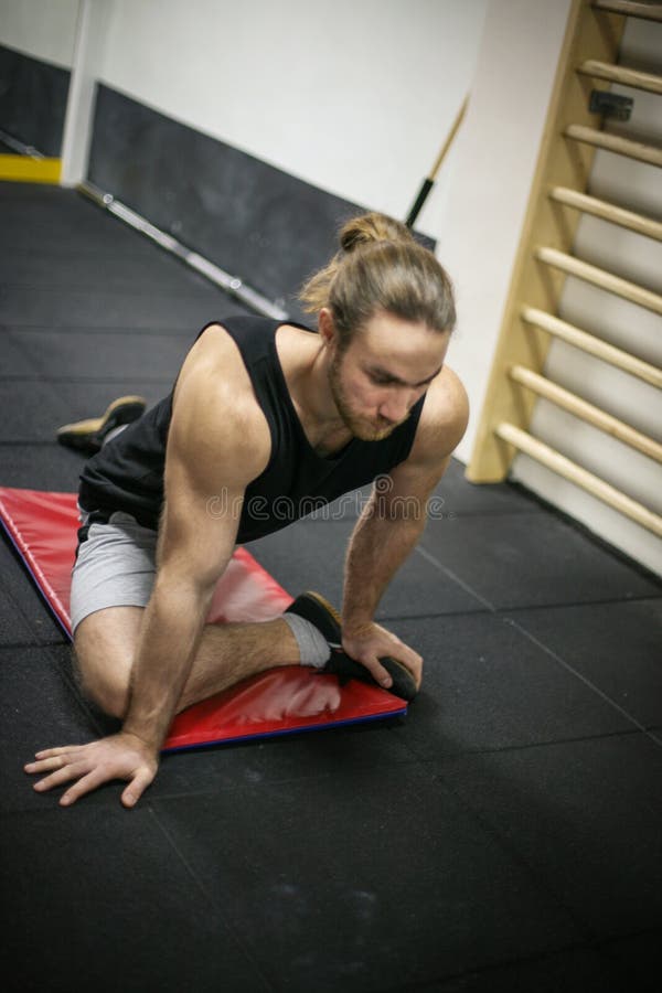 Young Man Working Out in the Gym. Stock Photo - Image of fitness ...