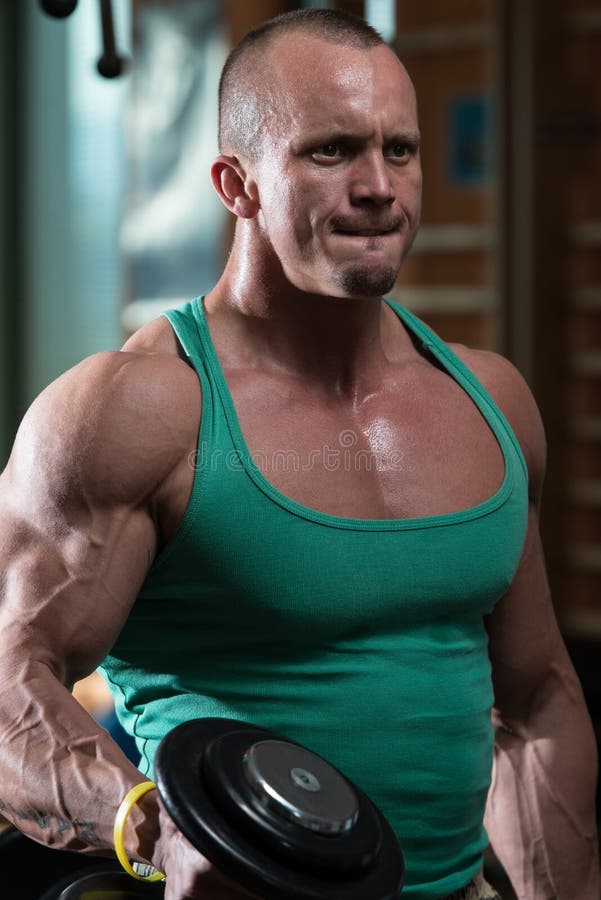 Young Man Working Out in a Health Club Stock Image - Image of male ...