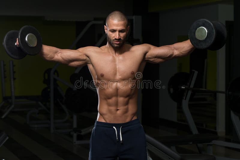 Young Man Working Out Shoulders Stock Image - Image of competition ...