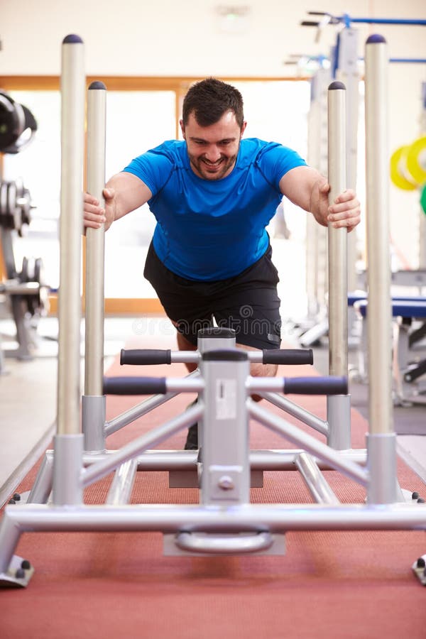 Young Man Working Out Using Equipment at a Gym, Vertical Stock Image ...