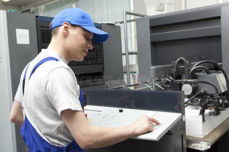 Young Man Working in Print Factory Stock Photo - Image of industrial ...