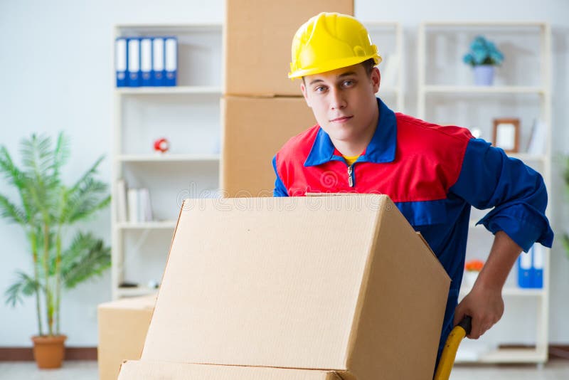 The Young Man Working in Relocation Services with Boxes Stock Image ...
