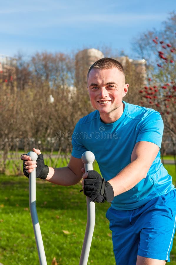 Young Man Working on Running Machine Stock Photo - Image of athletic ...