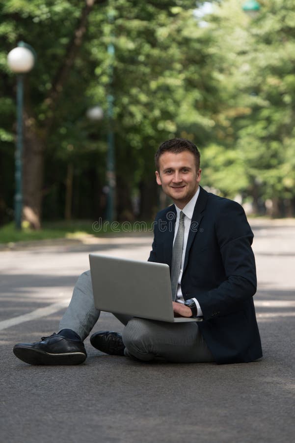 Young Man Working on Tablet Outside the Office Stock Image - Image of ...