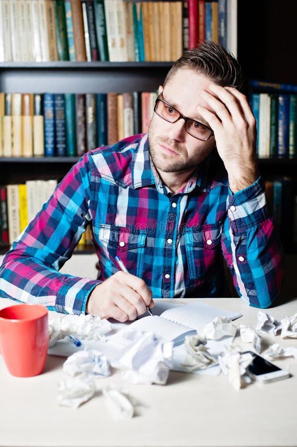 Young Man Working and Thinking in the Workplace Stock Photo - Image of ...