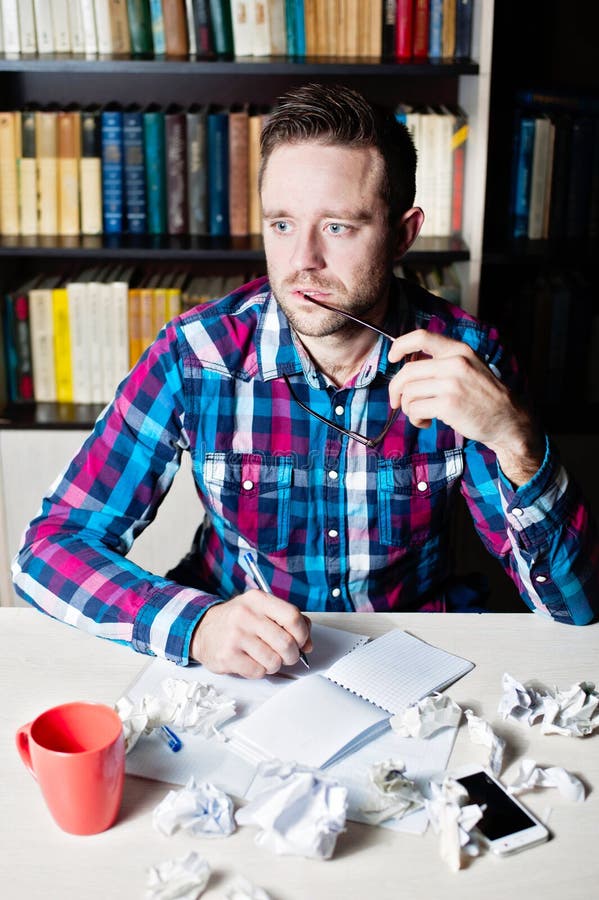 Young Man Working and Thinking in the Workplace Stock Image - Image of ...