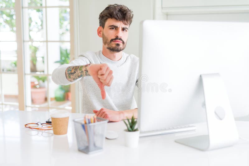 Young Man Working Using Computer with Angry Face, Negative Sign Showing ...