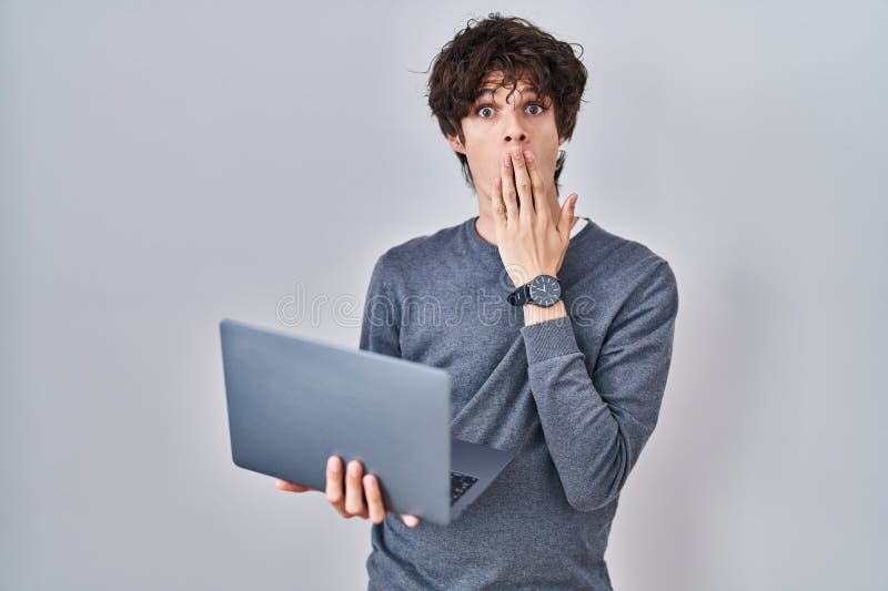 Young Man Working Using Computer Laptop Covering Mouth with Hand ...