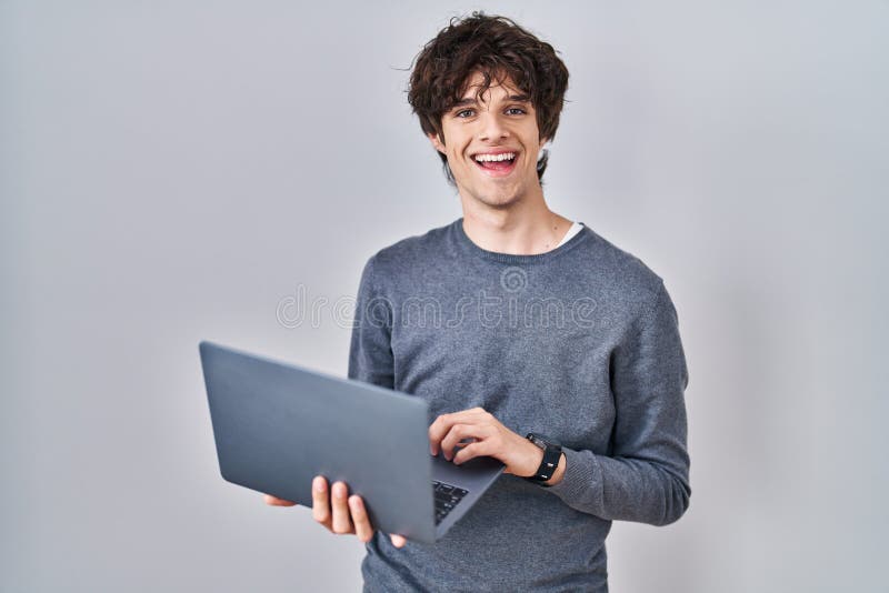 Young Man Working Using Computer Laptop Looking Positive and Happy ...