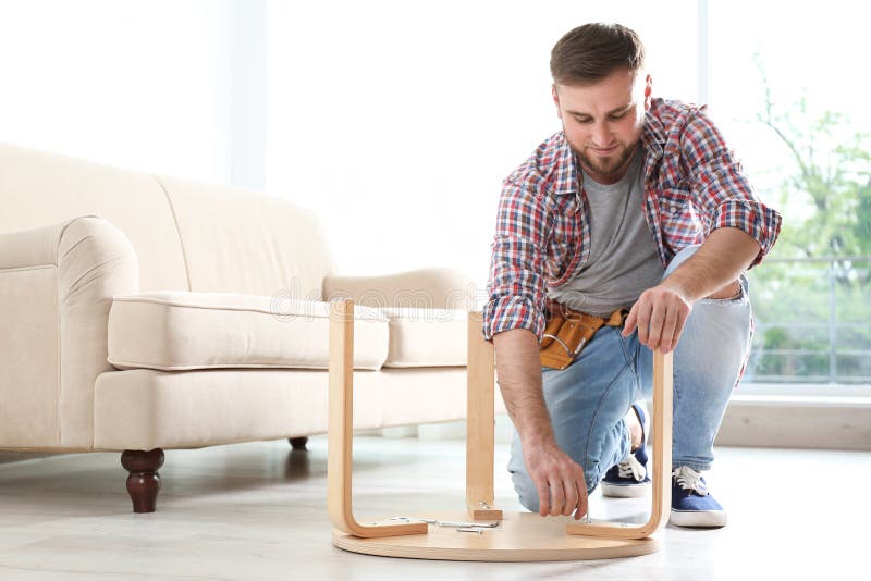Young Man Working with Wooden Chair Indoors Stock Image - Image of ...