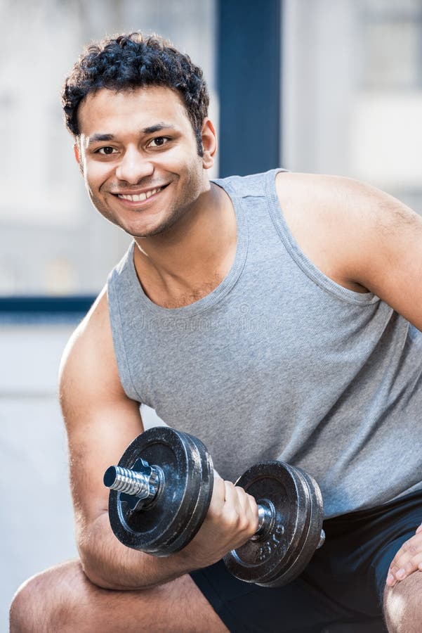 Young Man Workout with Dumbbell at Gym Stock Photo - Image of athletic ...