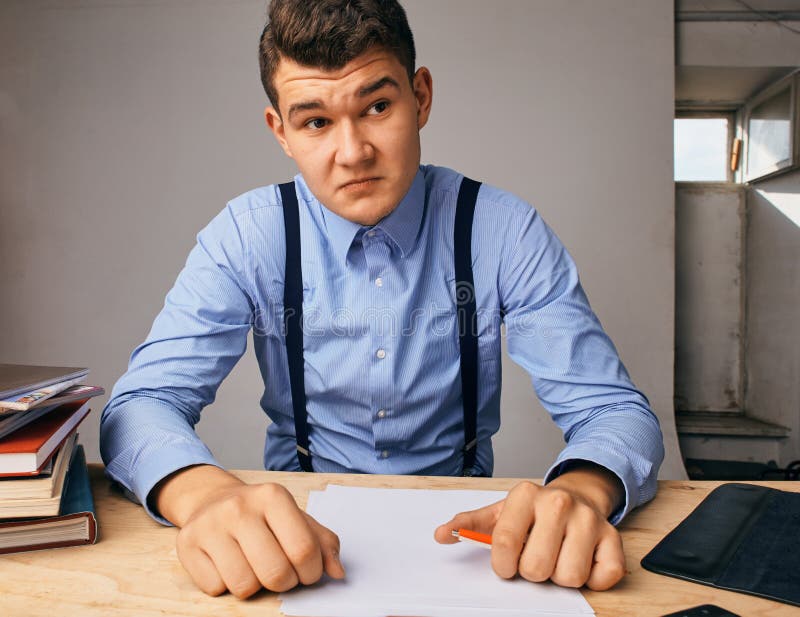 Young Man in the Workplace Thinking about Something Stock Photo - Image ...