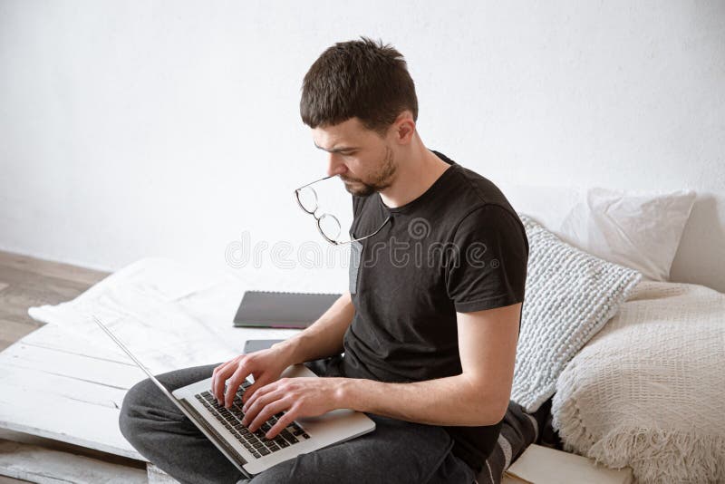A Young Man Works Remotely at a Computer at Home Stock Image - Image of ...