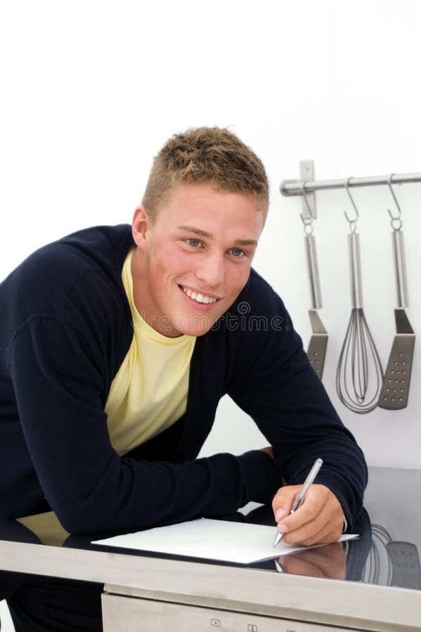 Young Man Writing Down Recipe Stock Photo - Image of adult, recipe ...